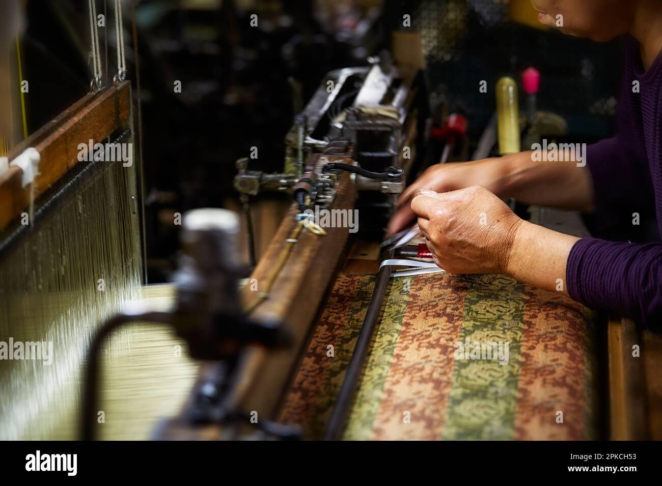 Nishijin weaving machine and craftsman's hand Stock Photo - Alamy