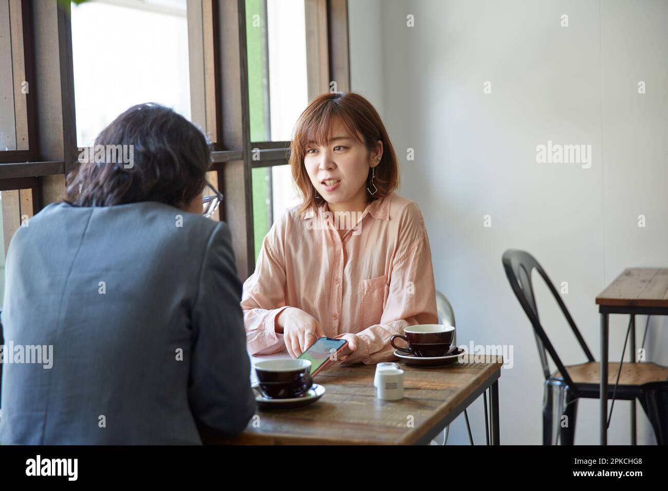 A woman soliciting a businessman Stock Photo - Alamy