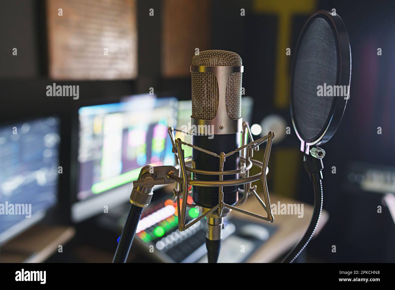 Close-up of microphone with blurred professional recording studio ...
