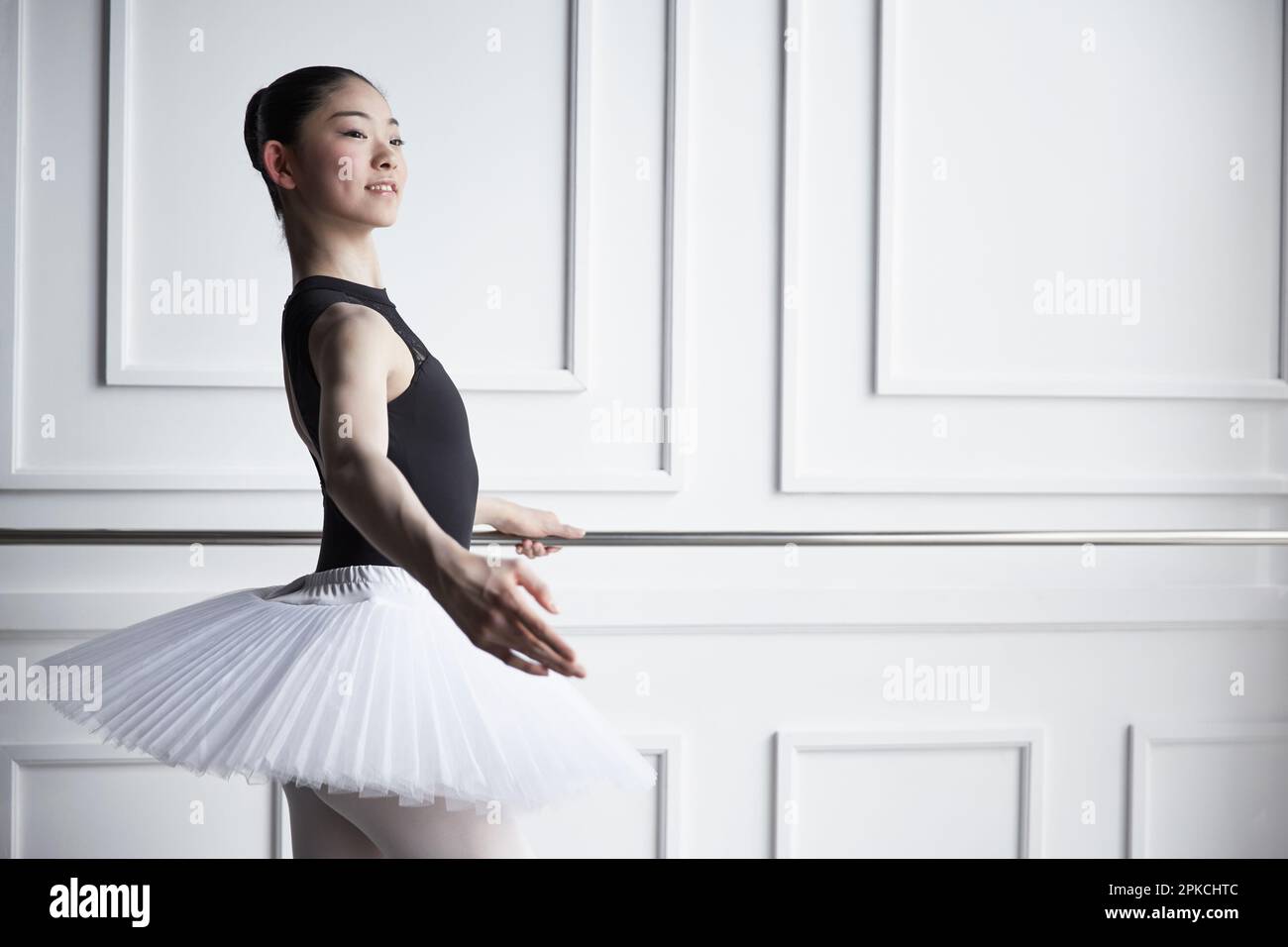 Ballerina posing with a bar Stock Photo - Alamy