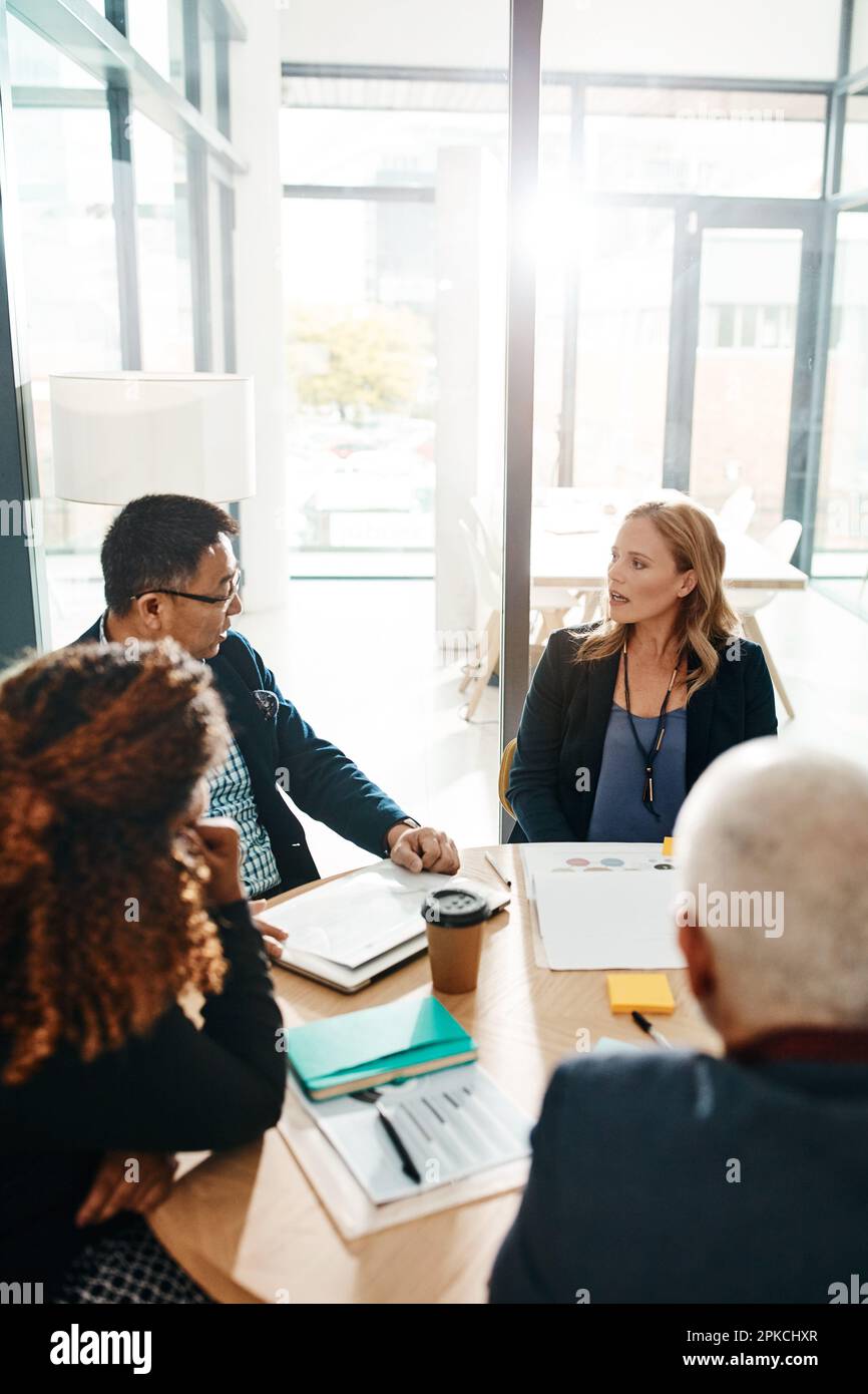 Teamwork always works best. a group of businesspeople having a meeting ...