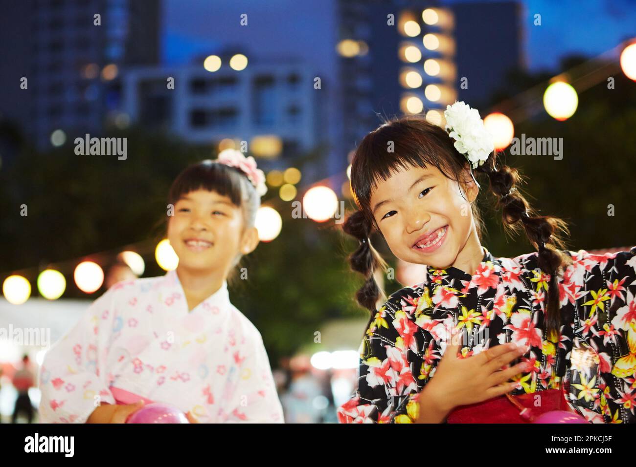 Girl in a yukata dancing bon dance at a festival Stock Photo - Alamy