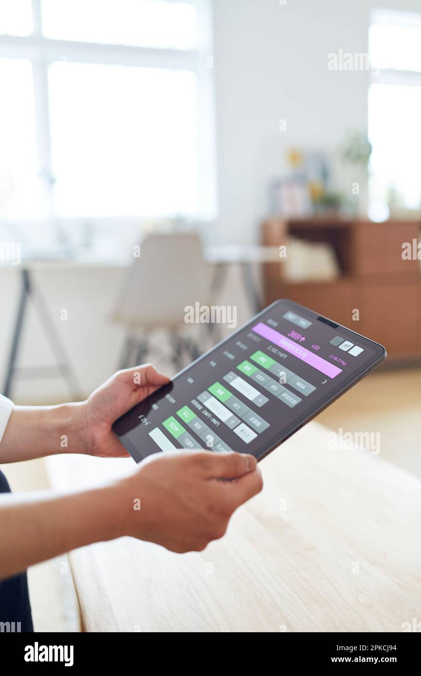 A hand placing a stock order with the tablet at home Stock Photo - Alamy