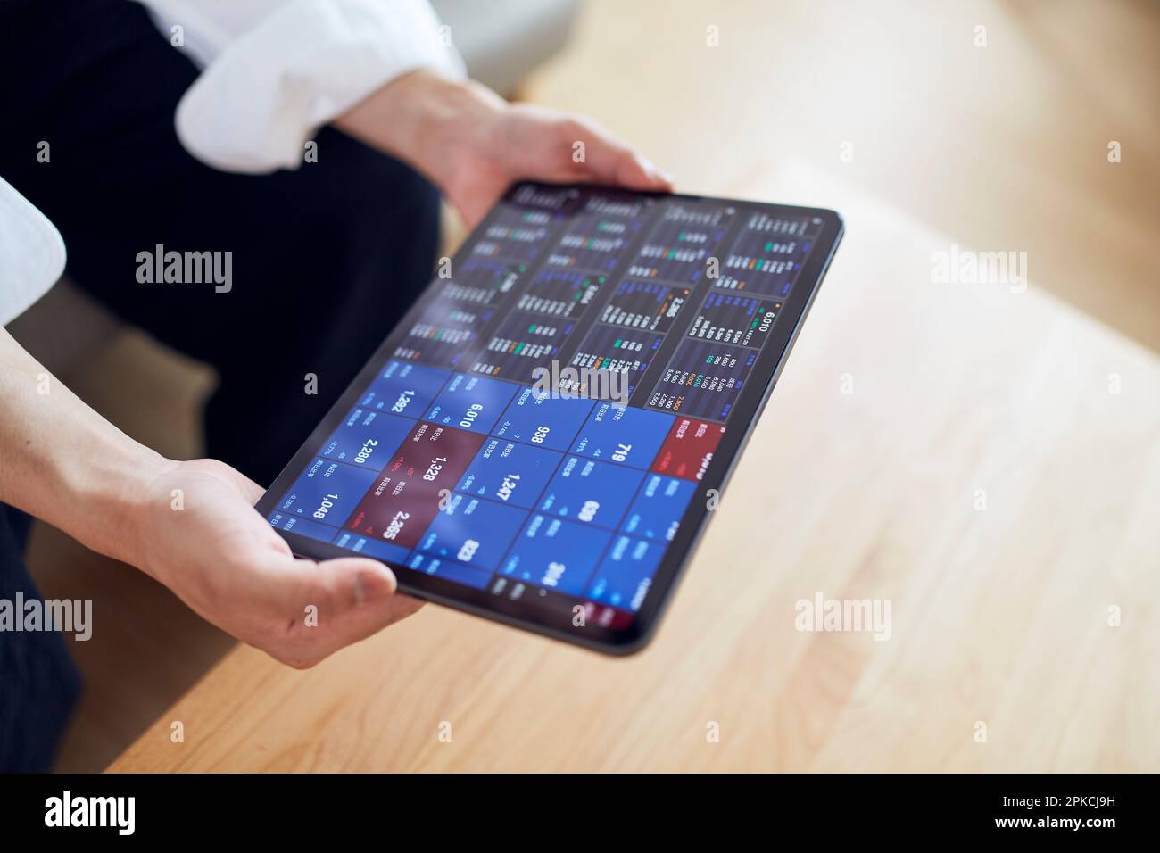 Hand checking the stock navigation system with a tablet Stock Photo - Alamy