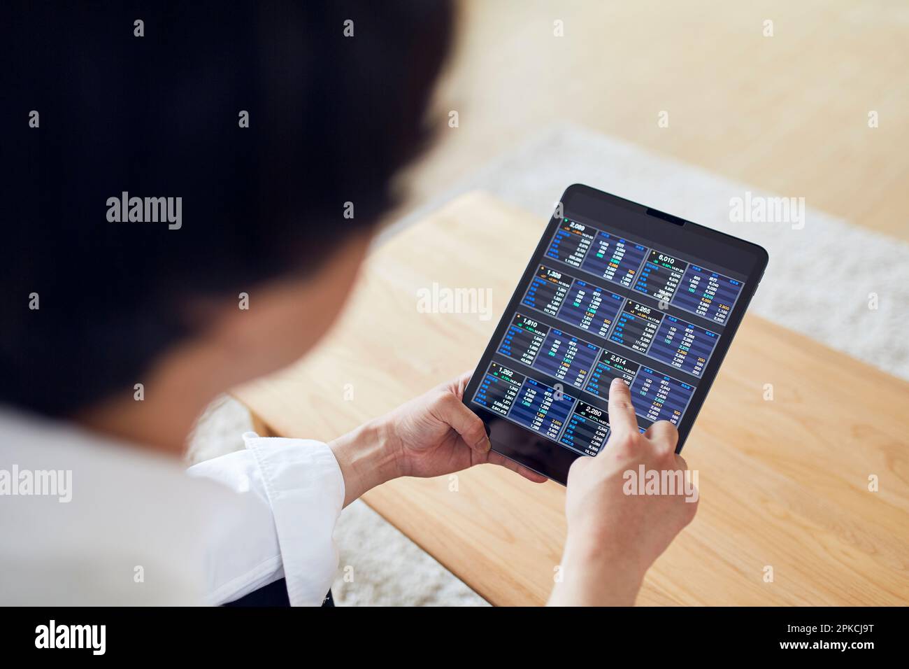 A hand checking the stock navigation system with a tablet Stock Photo ...