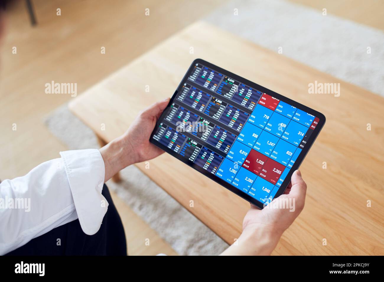 A hand checking the stock navigation system on a tablet Stock Photo - Alamy