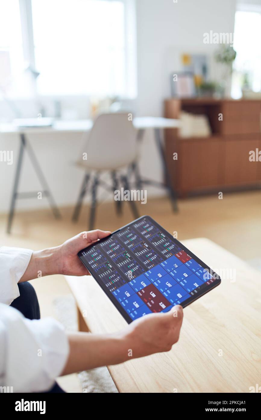 Hand checking the stock navigation system with a tablet at home Stock ...