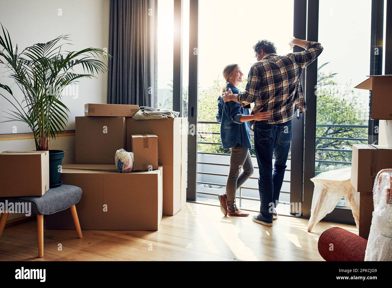 Tomorrow is another day. a cheerful middle aged couple looking into ...