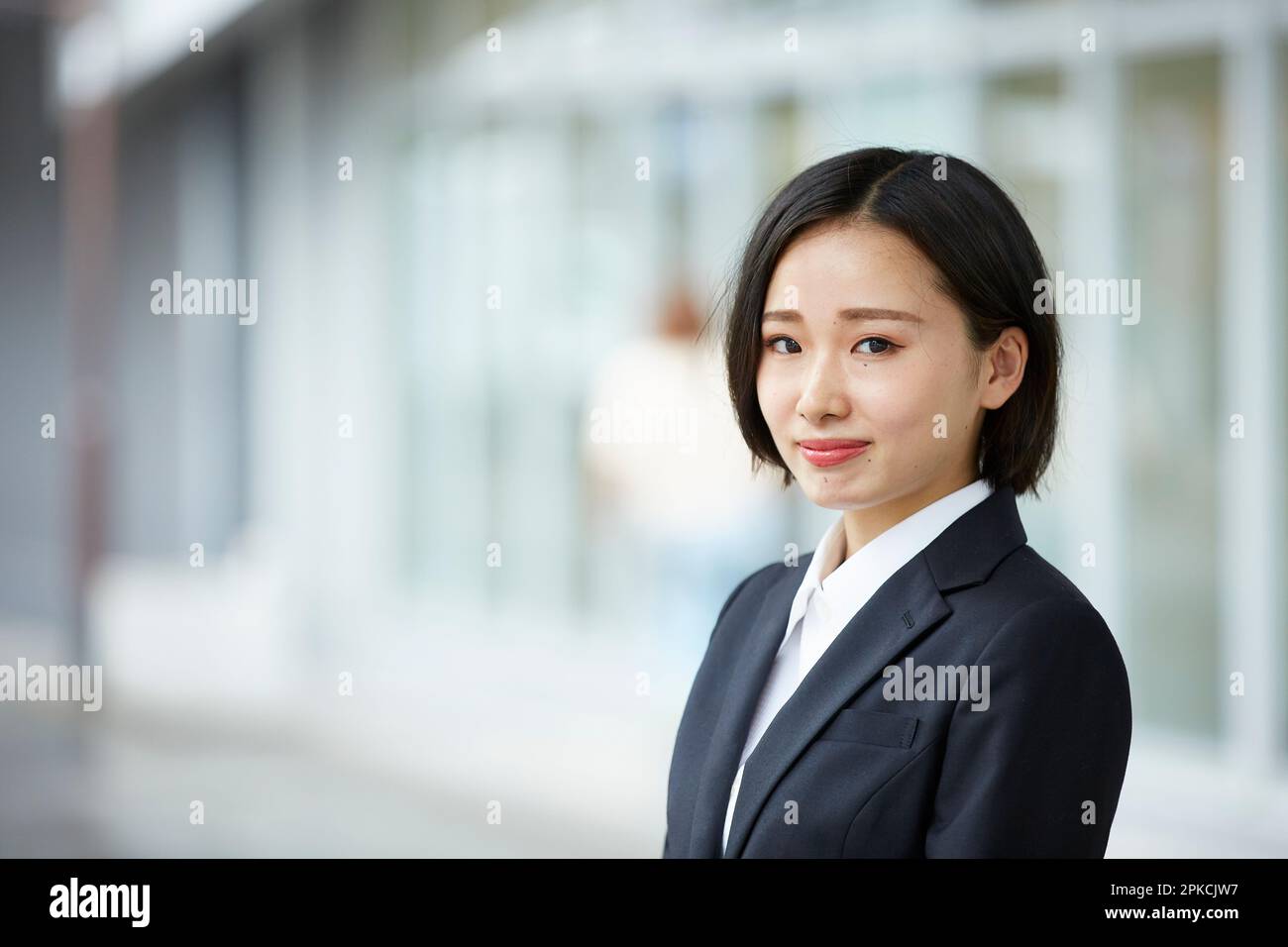 Woman in a recruit suit Stock Photo - Alamy