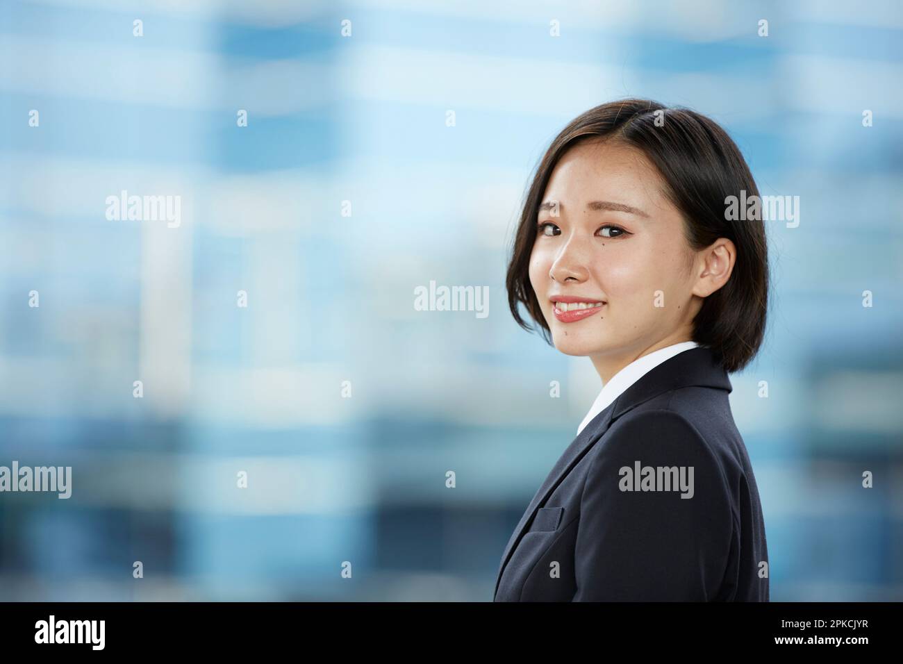 Woman in a Recruit Suit Smiling Stock Photo - Alamy
