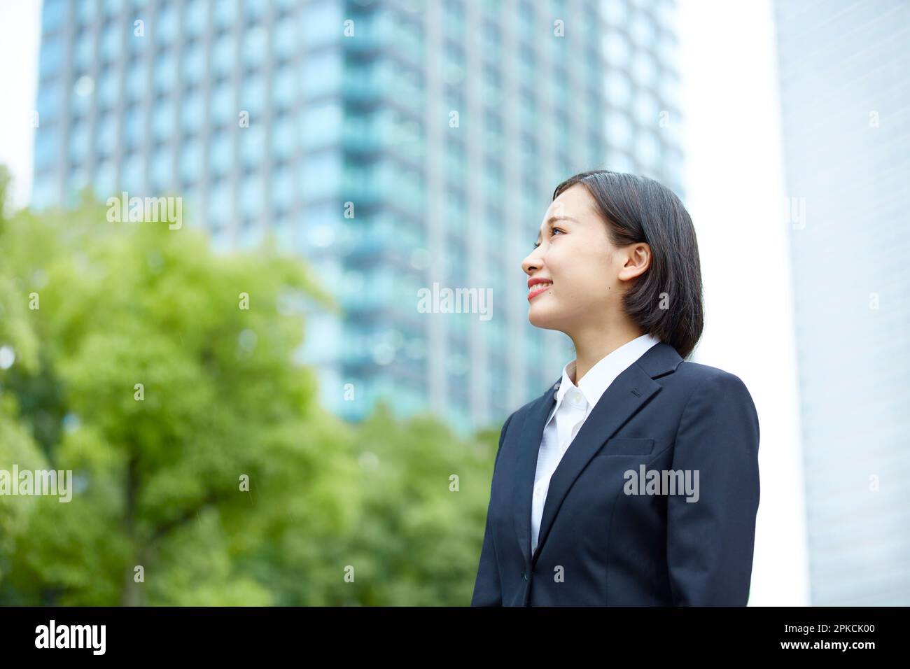 Smiling Woman in Recruit Suit with Background of Building Stock Photo ...