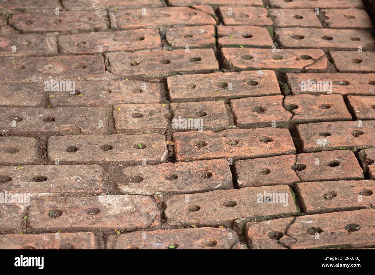 Worn old red brick ground as background Stock Photo - Alamy