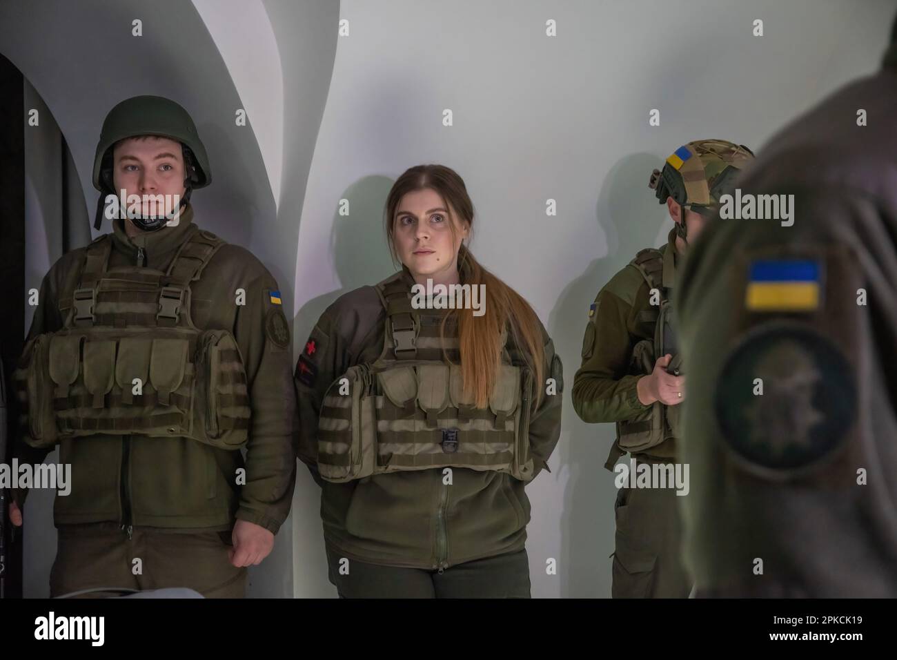 Military personnel stand in uniform at a presentation. Military ...