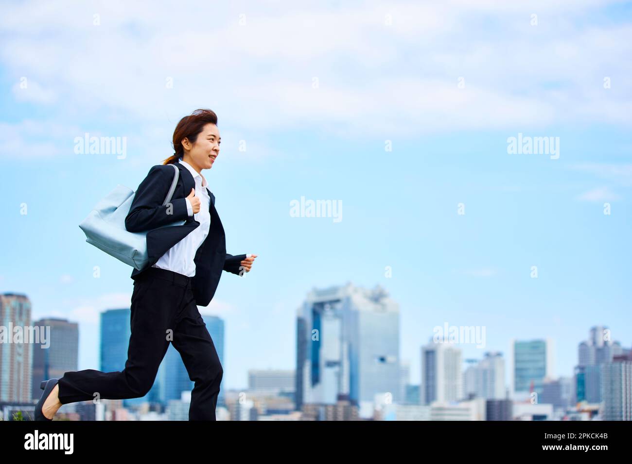 Running in a suit hi-res stock photography and images - Alamy