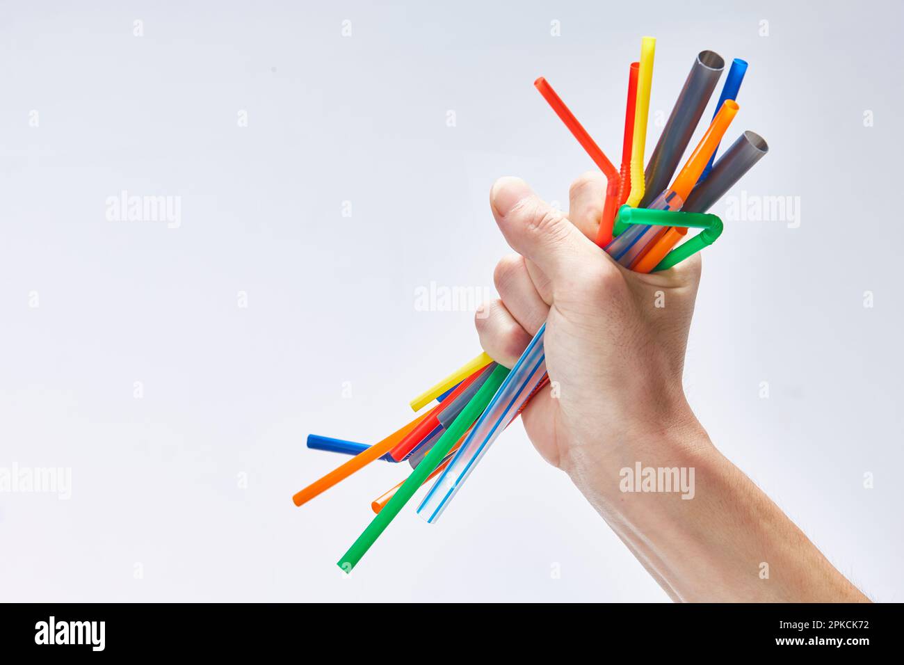 Hand clutching a straw trash Stock Photo - Alamy Hand clutching a straw trash Stock Photo - Alamy