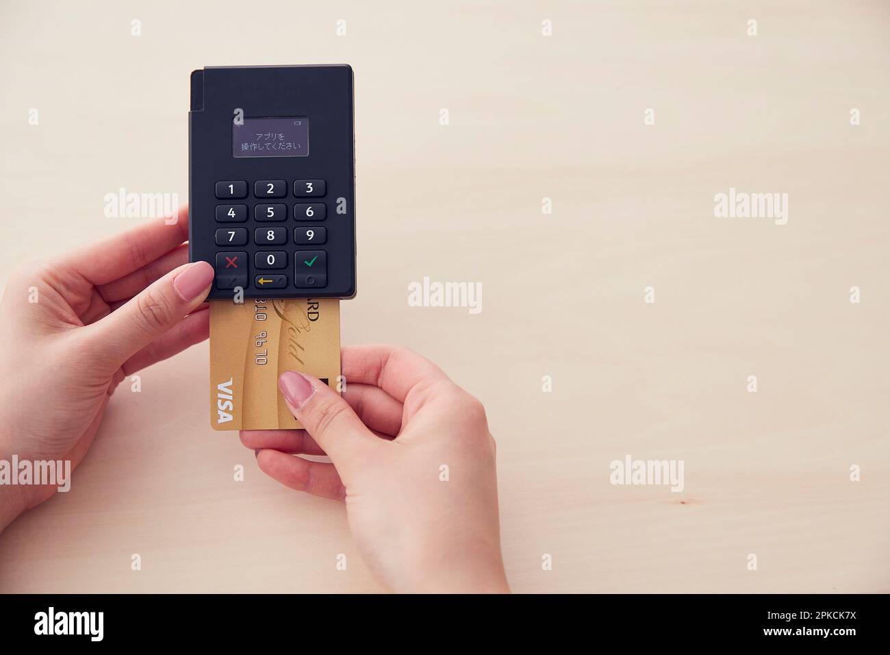 Inserting a credit card into a cashless payment terminal Stock Photo ...