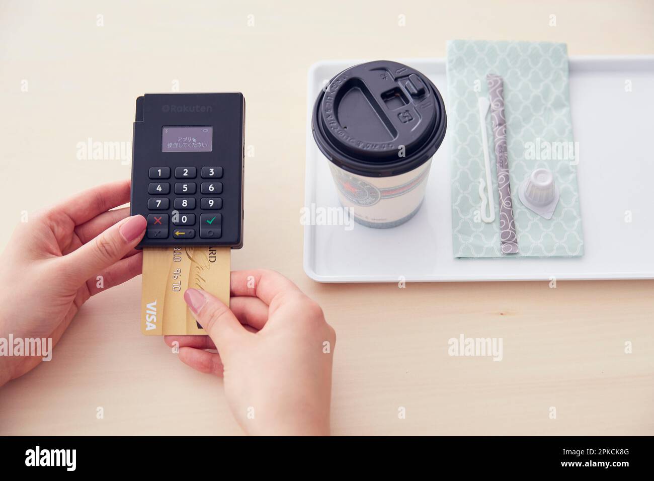 Inserting a credit card into a cashless payment terminal Stock Photo ...