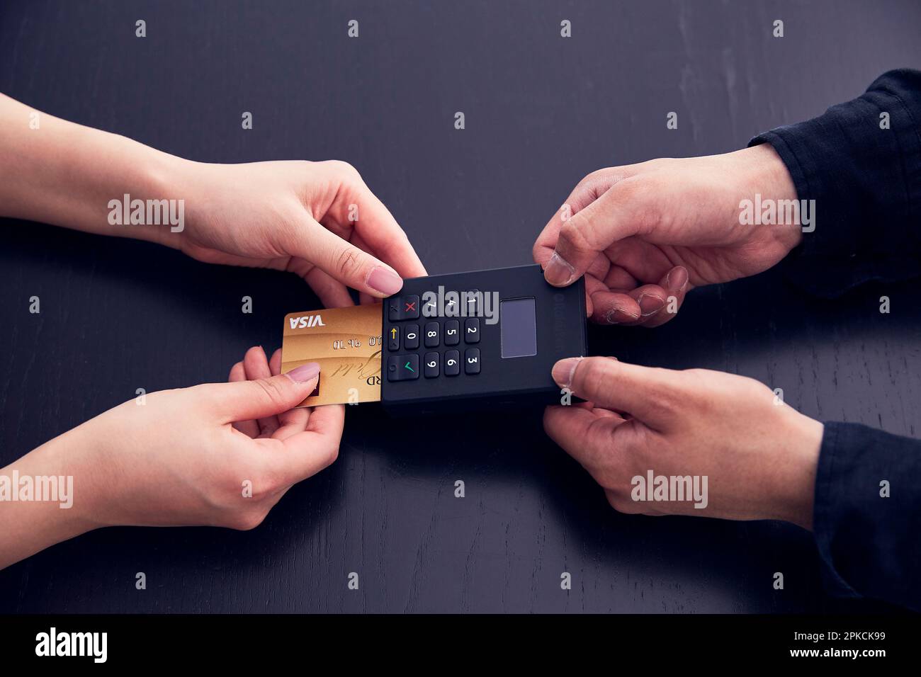 Inserting a credit card into a cashless payment terminal Stock Photo ...