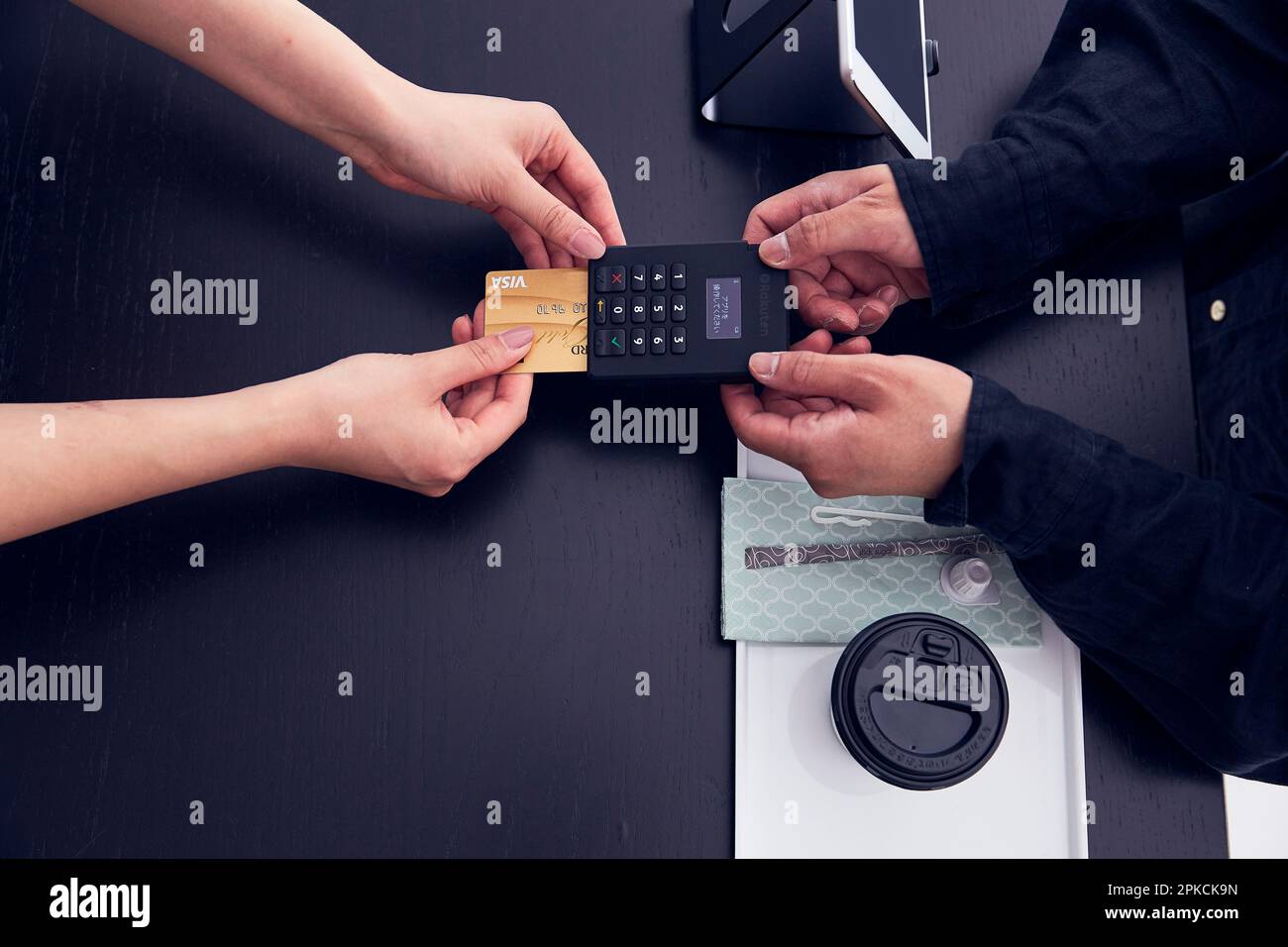 Inserting a credit card into a cashless payment terminal Stock Photo ...