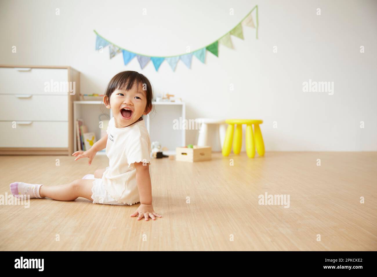 Girl looking back with a smile Stock Photo - Alamy