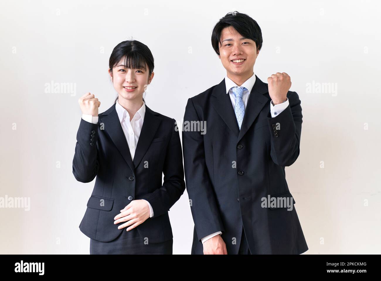 Male and female students in suits posing with their guts Stock Photo ...