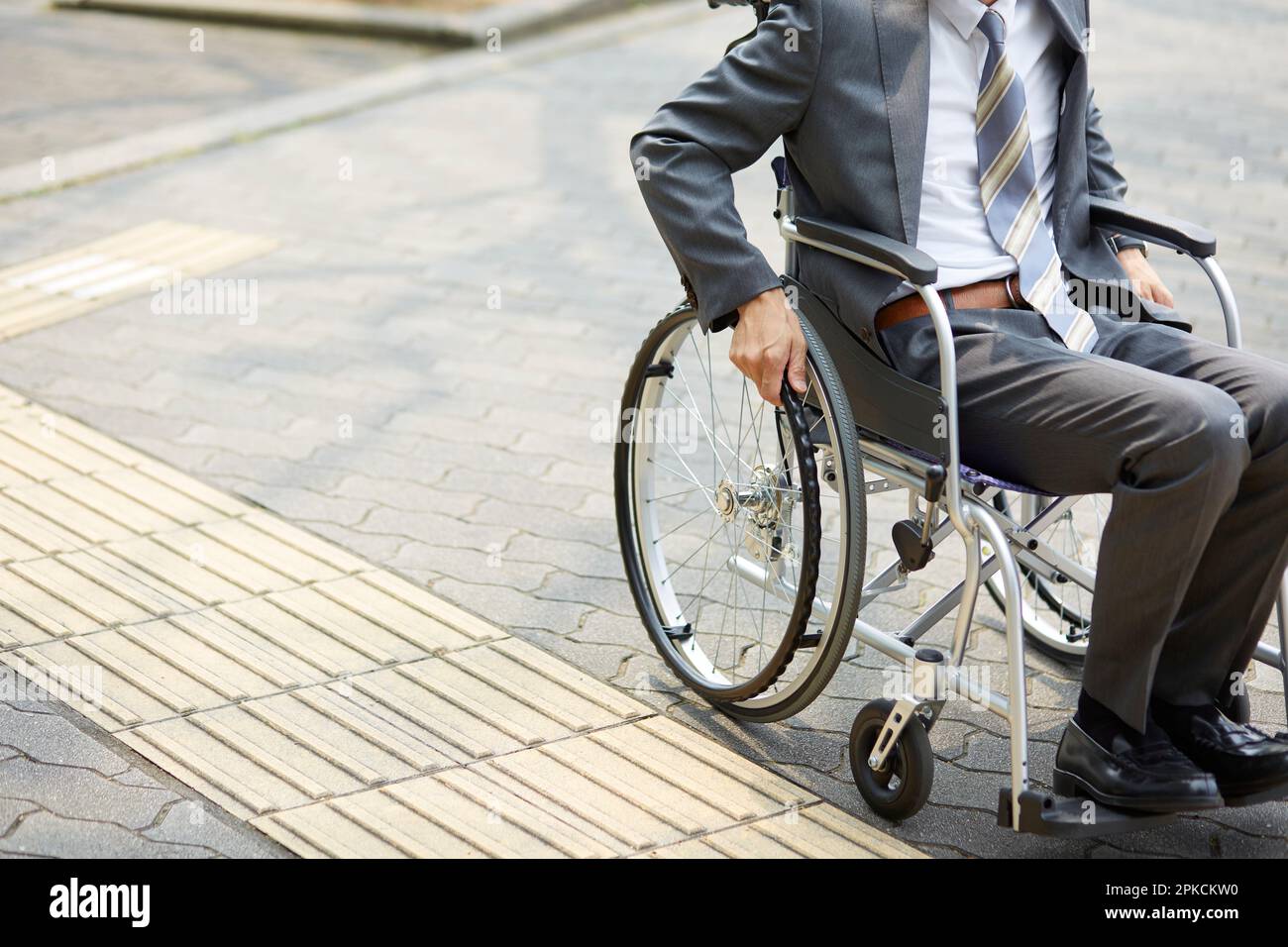 Disabled riding wheelchair in hi-res stock photography and images - Alamy