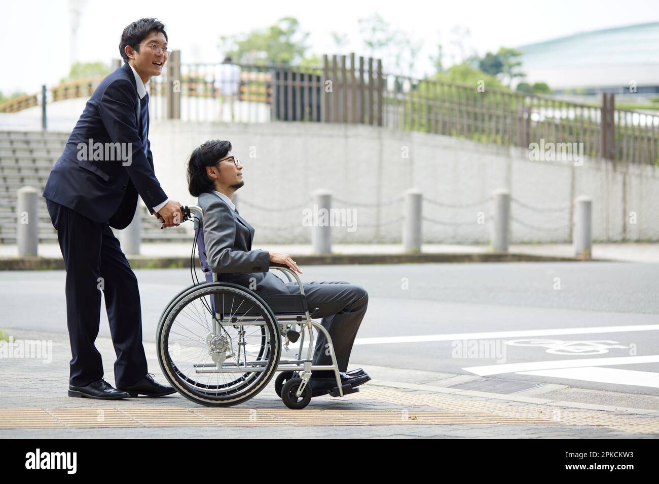 Pushing wheelchair push wheelchair hi-res stock photography and images ...