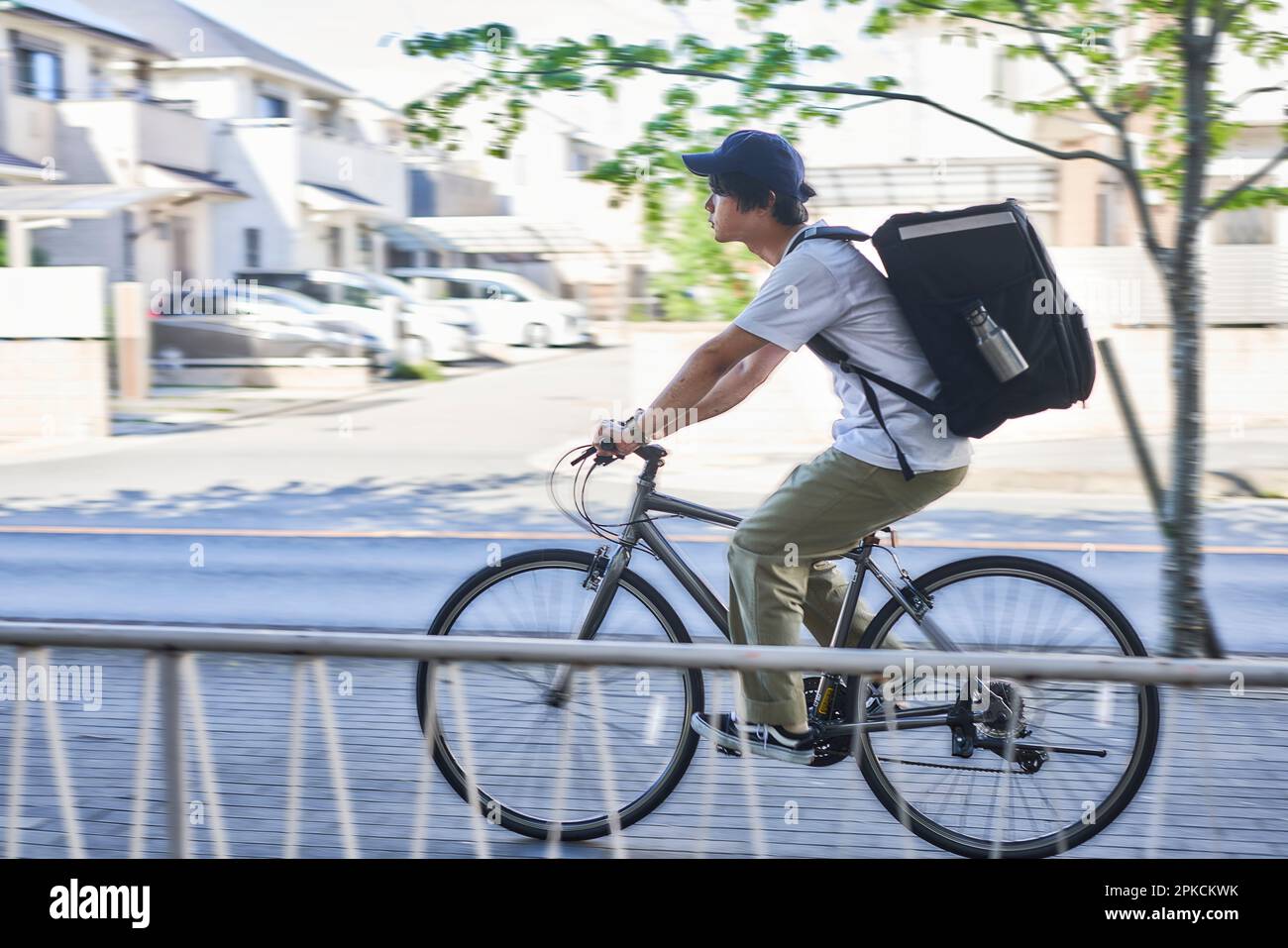Delivery man delivering food by bicycle Stock Photo - Alamy