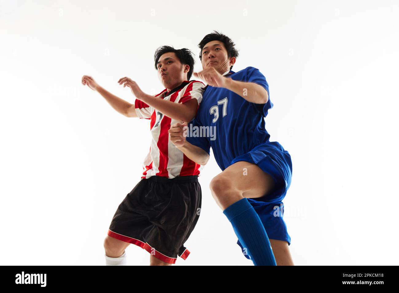 Soccer player competing with a header Stock Photo - Alamy