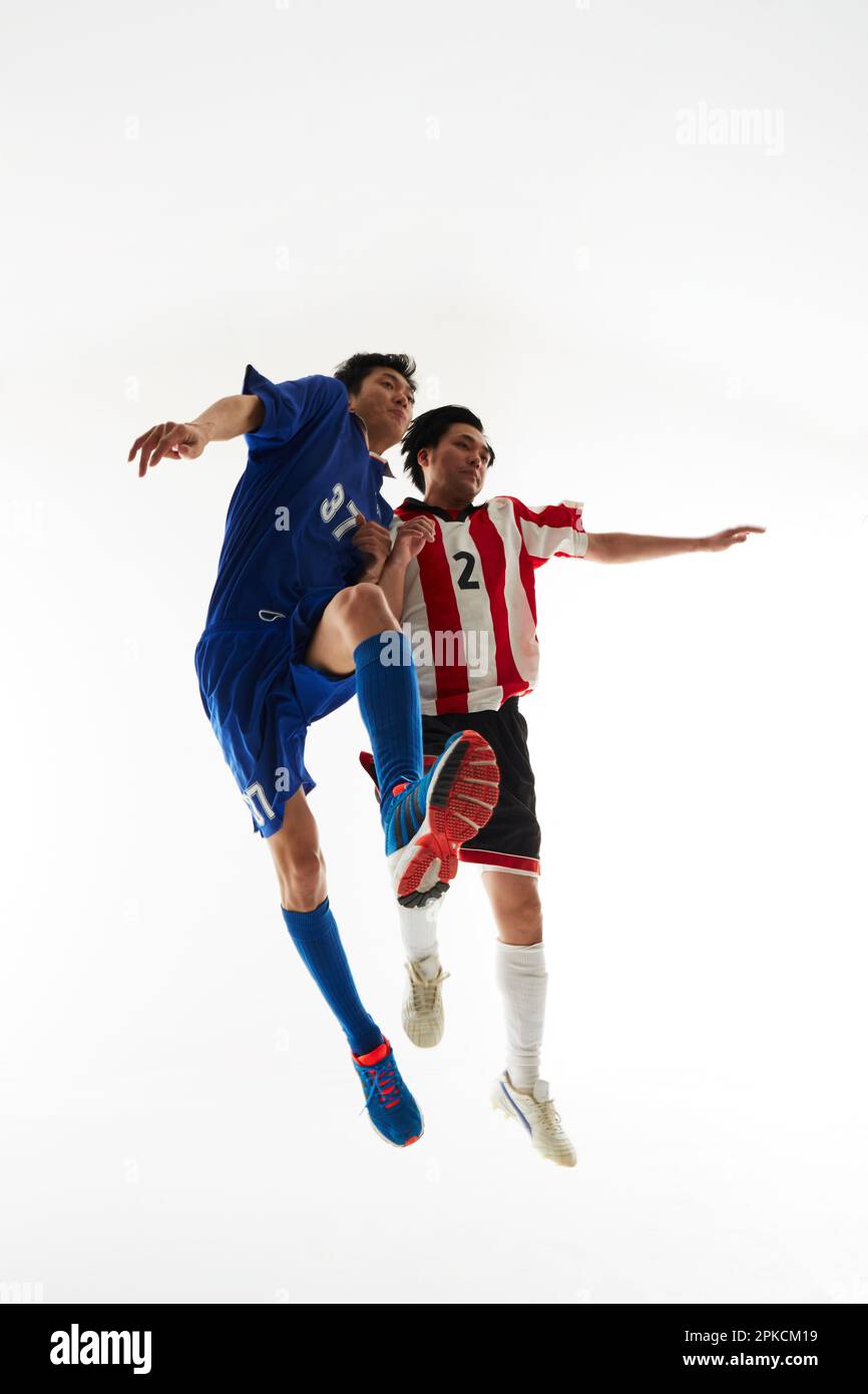 Soccer player competing with a header Stock Photo - Alamy