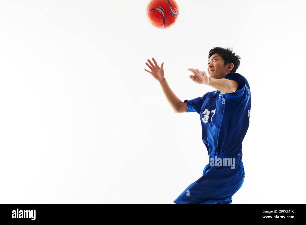 Soccer player competing for a header Stock Photo - Alamy