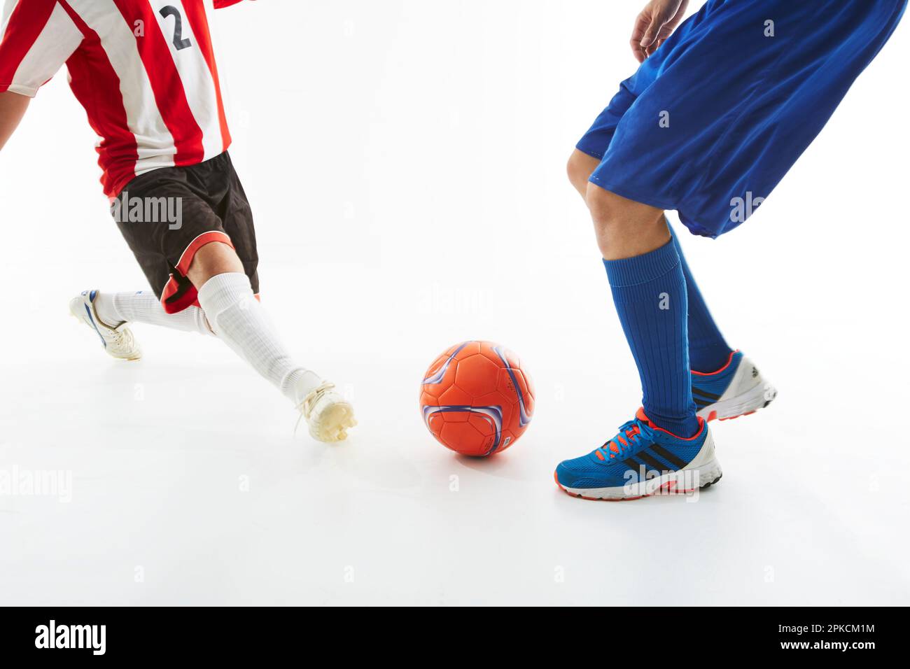 Soccer player cutting the ball of an opponent Stock Photo - Alamy