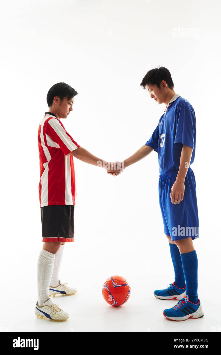 Soccer player shaking hands before a game Stock Photo - Alamy