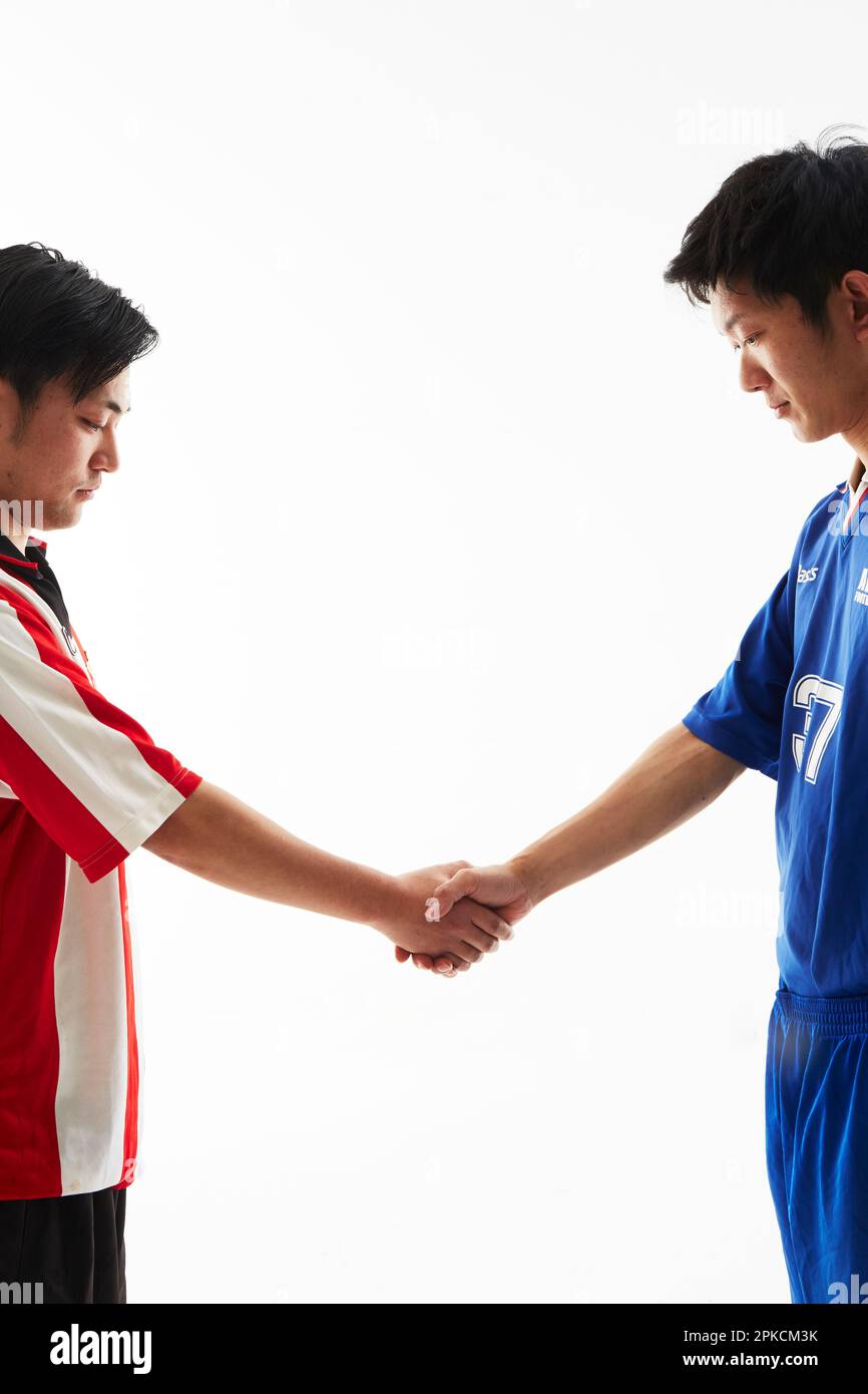 Soccer player shaking hands before a game Stock Photo - Alamy