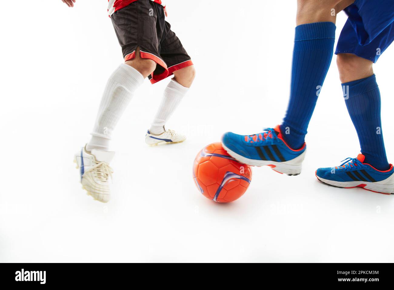 Soccer player cutting the ball of an opponent Stock Photo - Alamy