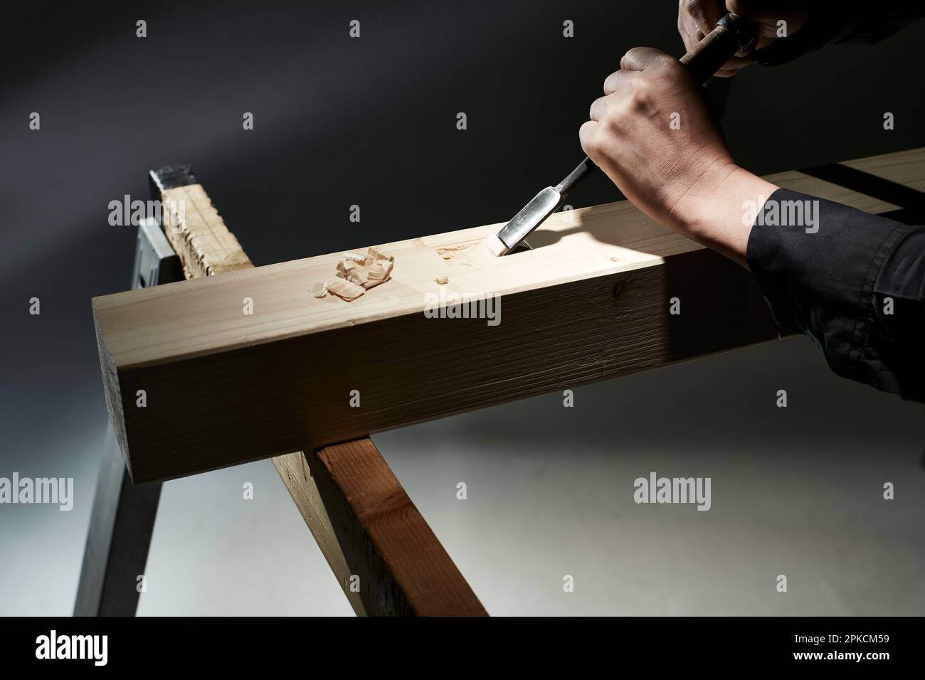 Male hand carving timber Stock Photo - Alamy