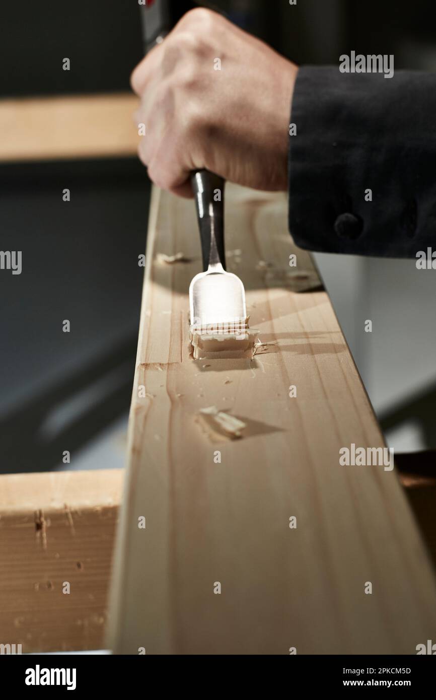 Man's hand carving timber Stock Photo - Alamy