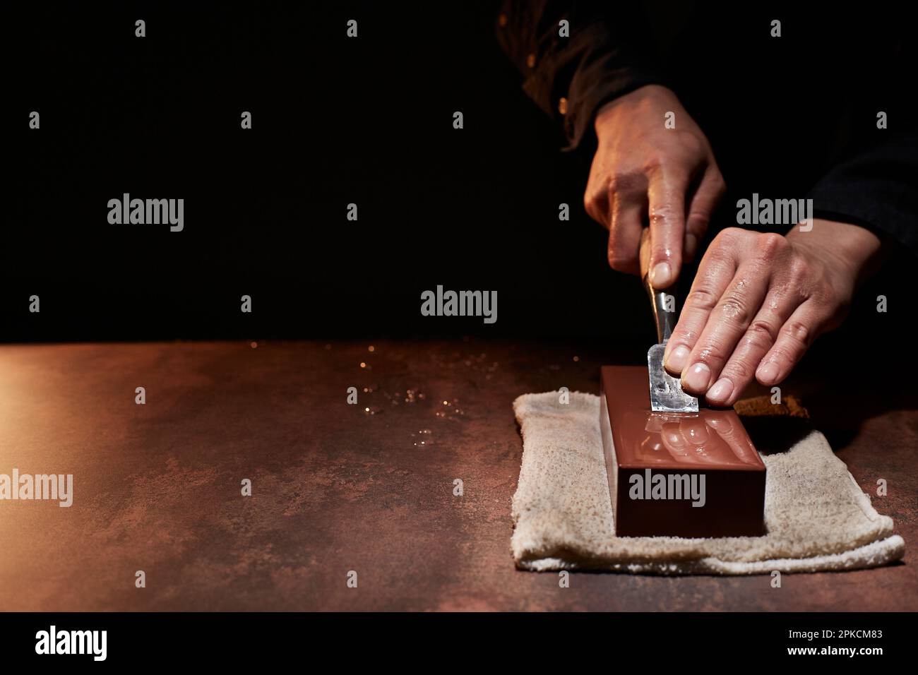 Man's hand sharpening chisel Stock Photo - Alamy