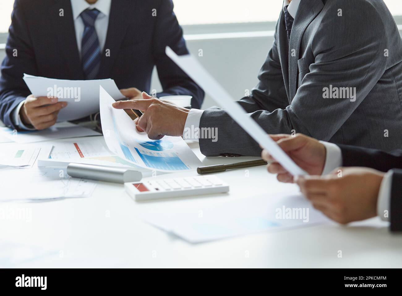 Three businessmen at work Stock Photo - Alamy