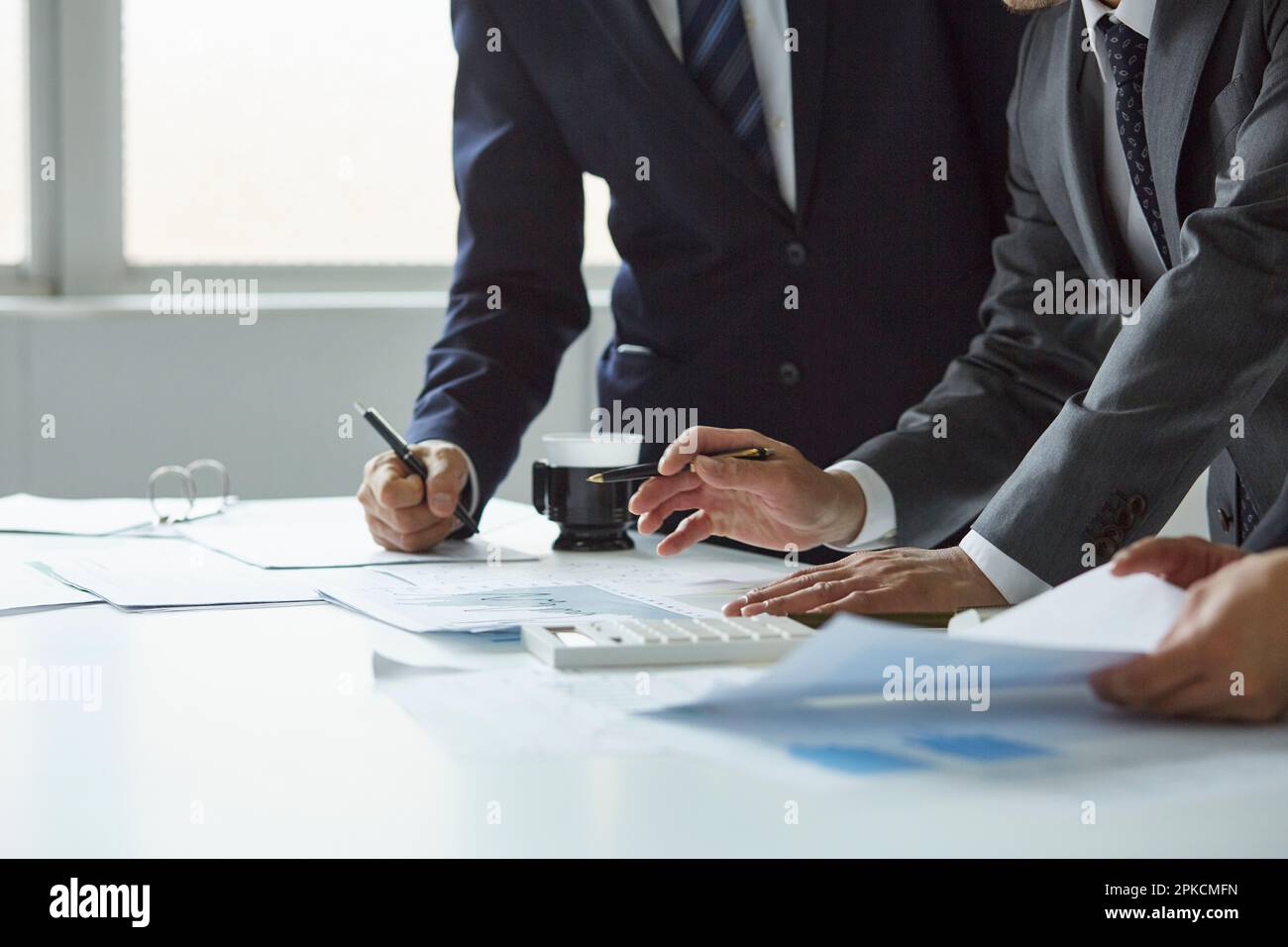 Three businessmen at work Stock Photo - Alamy