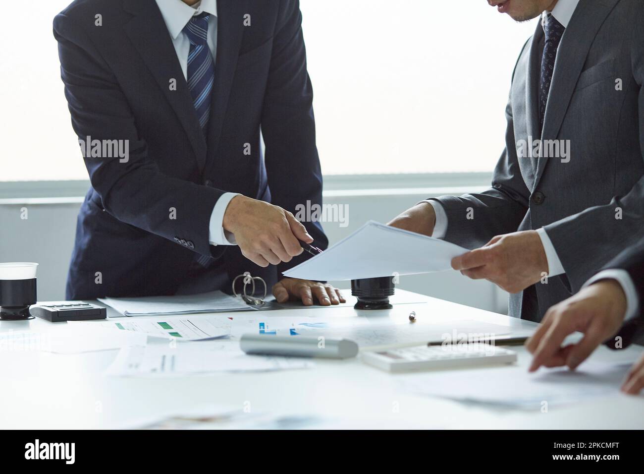 Three businessmen at work Stock Photo - Alamy