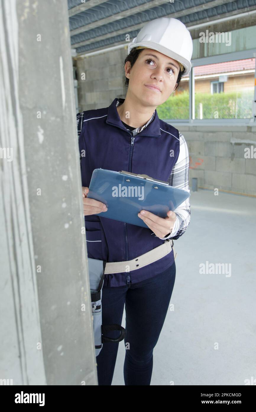 woman inspecting unfinished construction site Stock Photo - Alamy