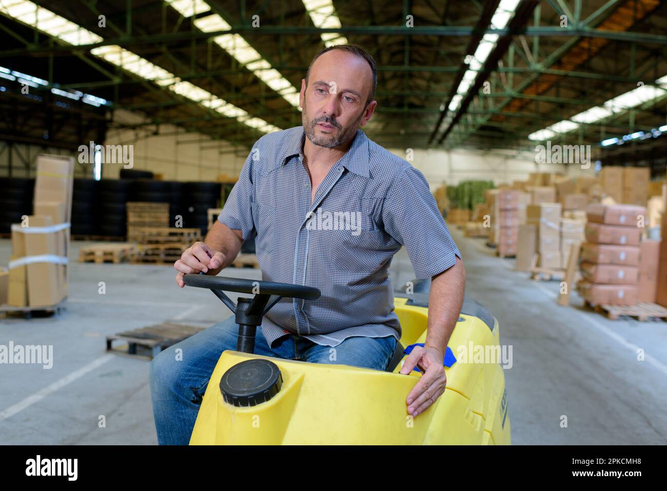 warehouse man worker with forklift Stock Photo - Alamy