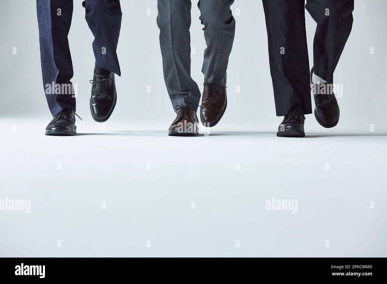 Men in suits walking hi-res stock photography and images - Alamy