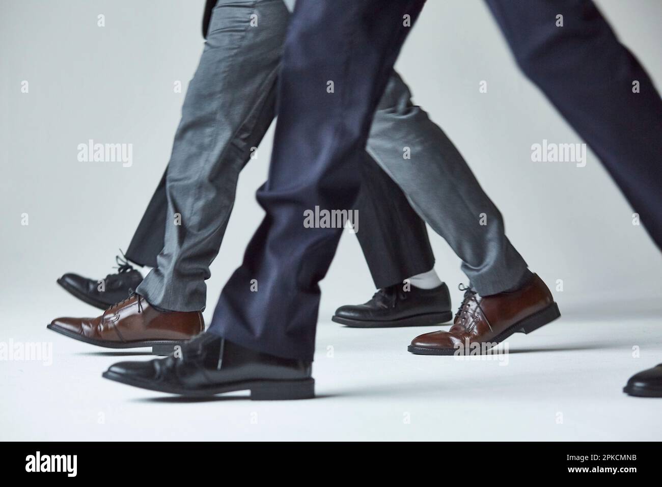 Men in suits walking hi-res stock photography and images - Alamy
