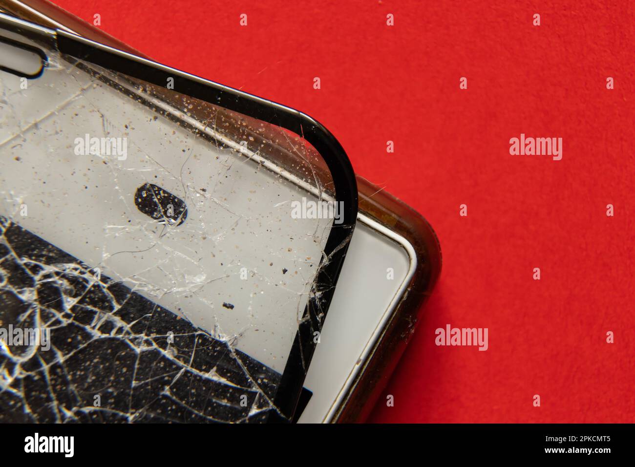 mobile phone and broken tempered glass on an isolated background, glass ...