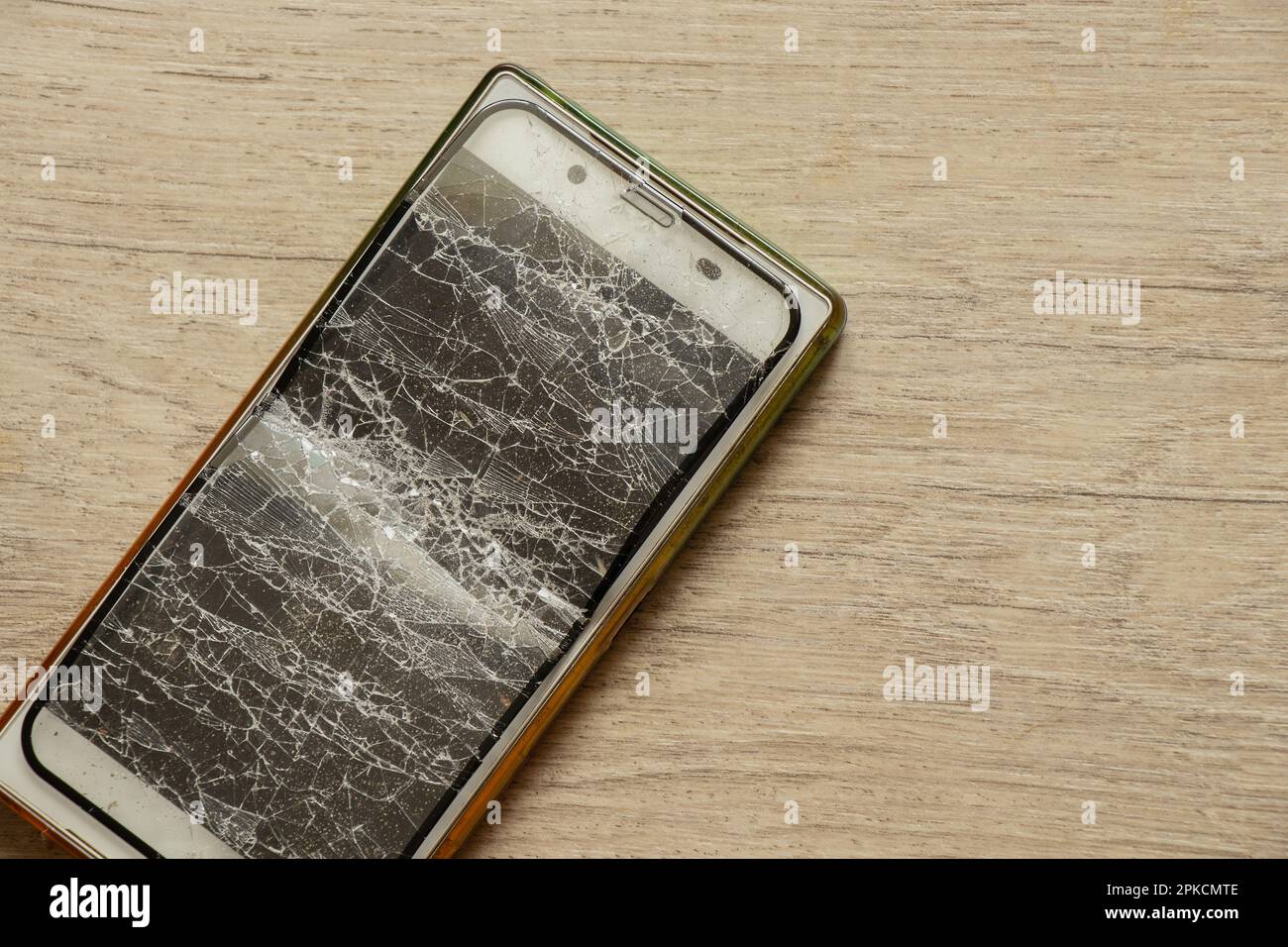 mobile phone and broken tempered glass on an isolated background, glass ...