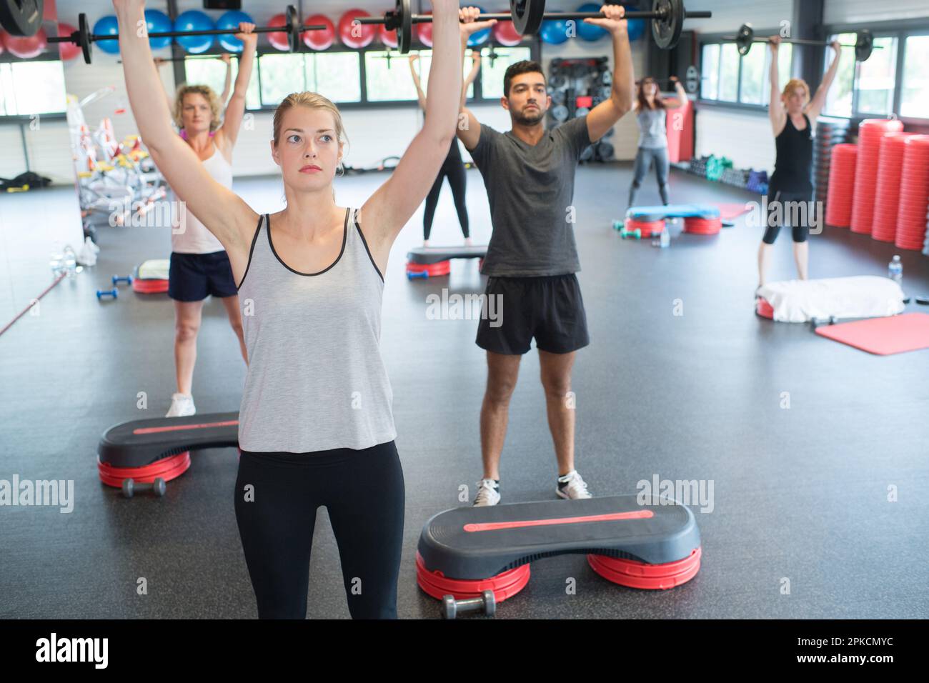 people are holding the body bars Stock Photo - Alamy