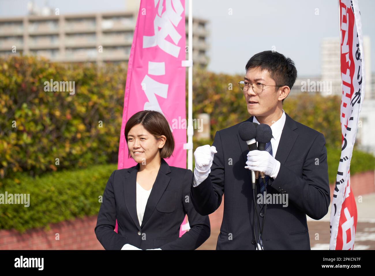 Man and woman campaigning Stock Photo - Alamy