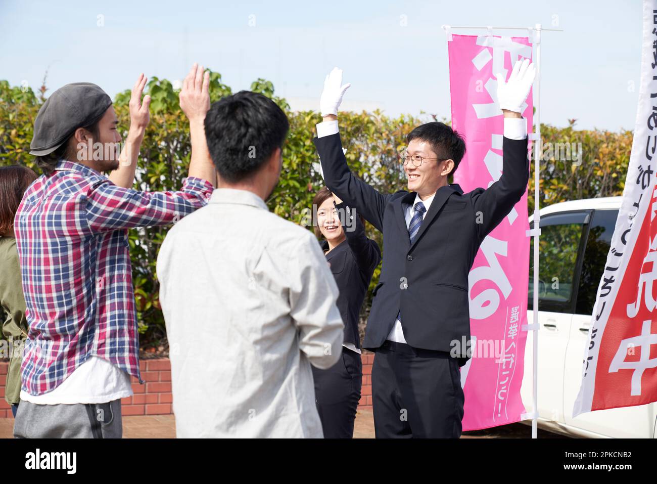 Men in electioneering suits Stock Photo - Alamy